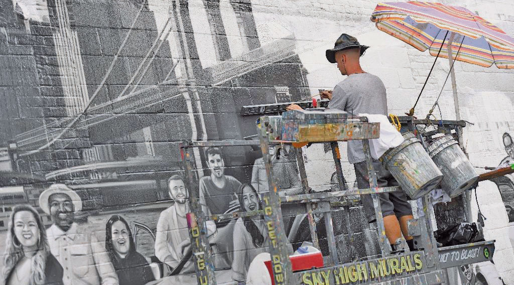 NY goes back in time with revival of hand-painted ads - Oman Observer