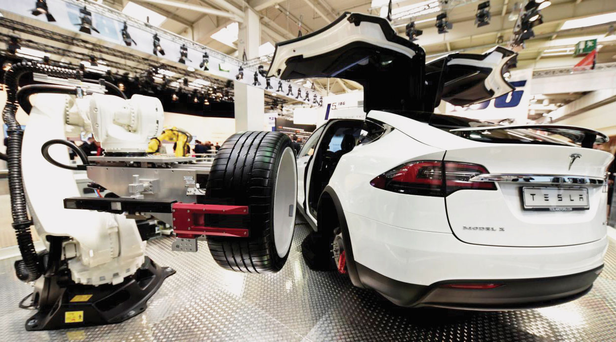 Tesla flies in equipment and robots for Model 3 production - Oman Observer