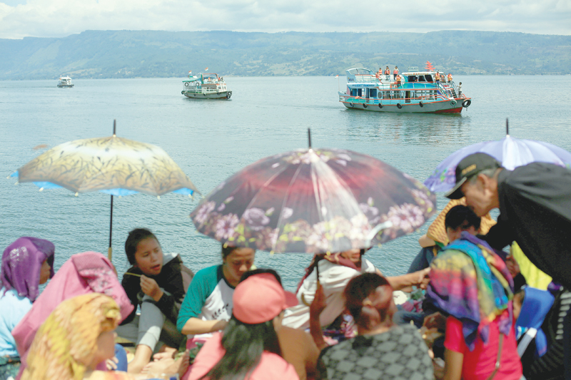 Indonesians face daunting task to recover bodies from ferry sunk in ...