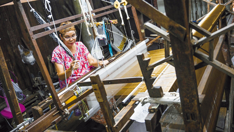 By a thread: Thai Muslim family keeps silk weaving heritage alive ...