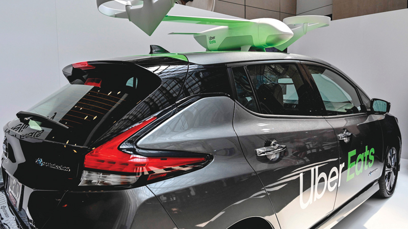 Uber eyes drones for food delivery, unveils new self-driving car - Oman ...