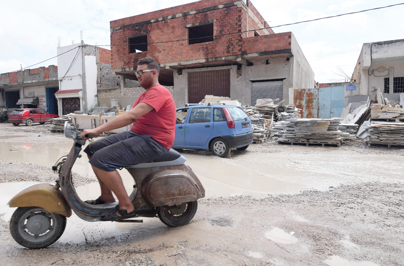 Ahead of polls, residents of poverty-stricken Tunis suburb left bitter ...