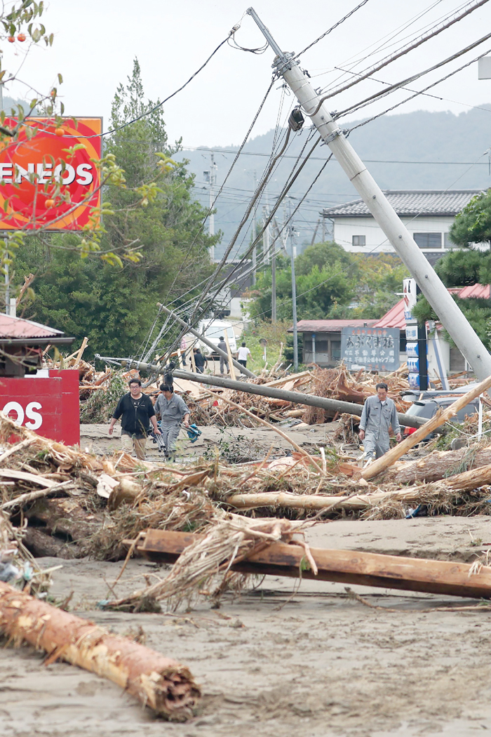 Rescue efforts hampered in Japan as typhoon death toll rises to 56 ...