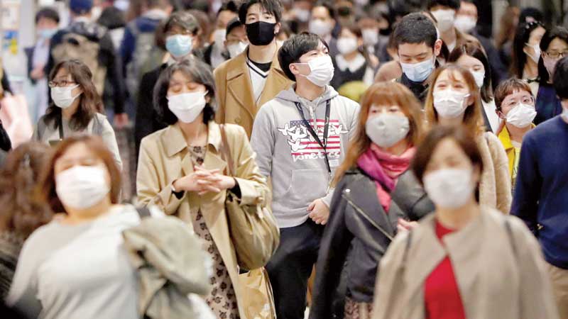 Tokyo raises virus alert to highest as cases set record - Oman Observer